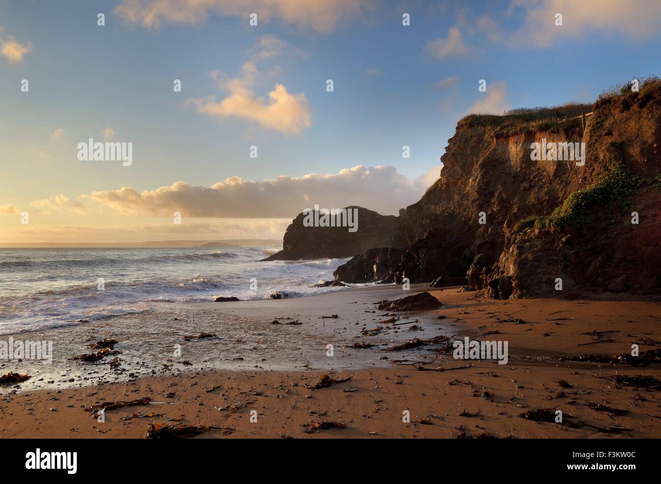 The sun setting at Hope Cove, Devon, England Stock Photo - Alamy
