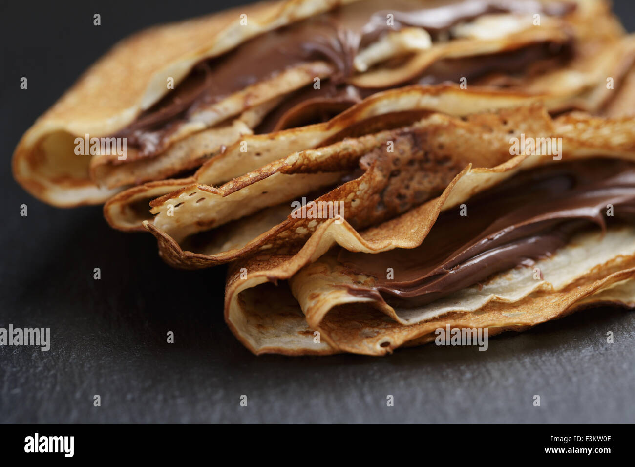thin crepes or blinis with chocolate cream Stock Photo - Alamy