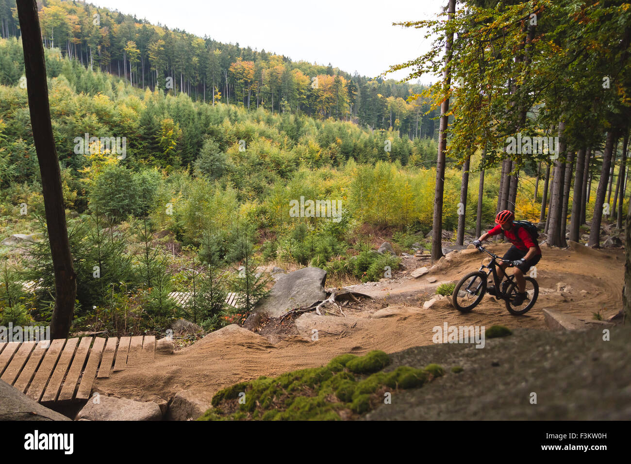 Mountain biker riding on bike in autumn inspirational mountains ...