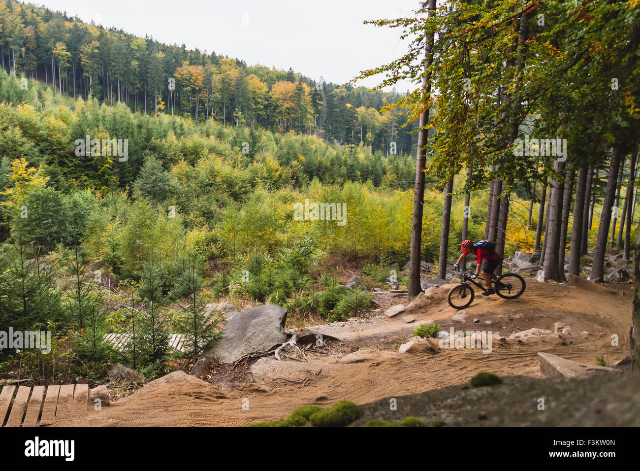 Mountain biker riding on bike in autumn inspirational mountains ...