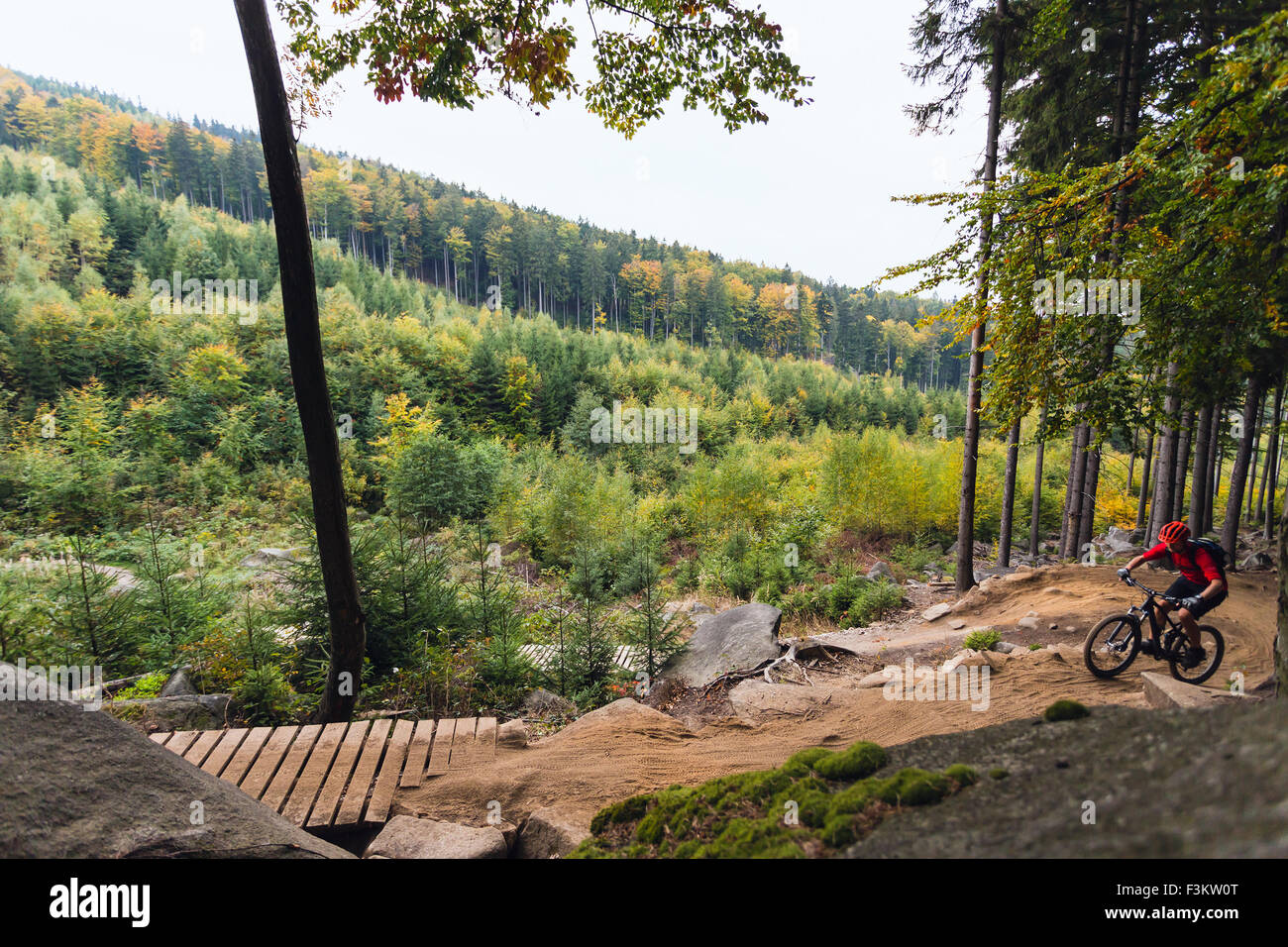 Mountain biker riding on bike in autumn inspirational mountains ...