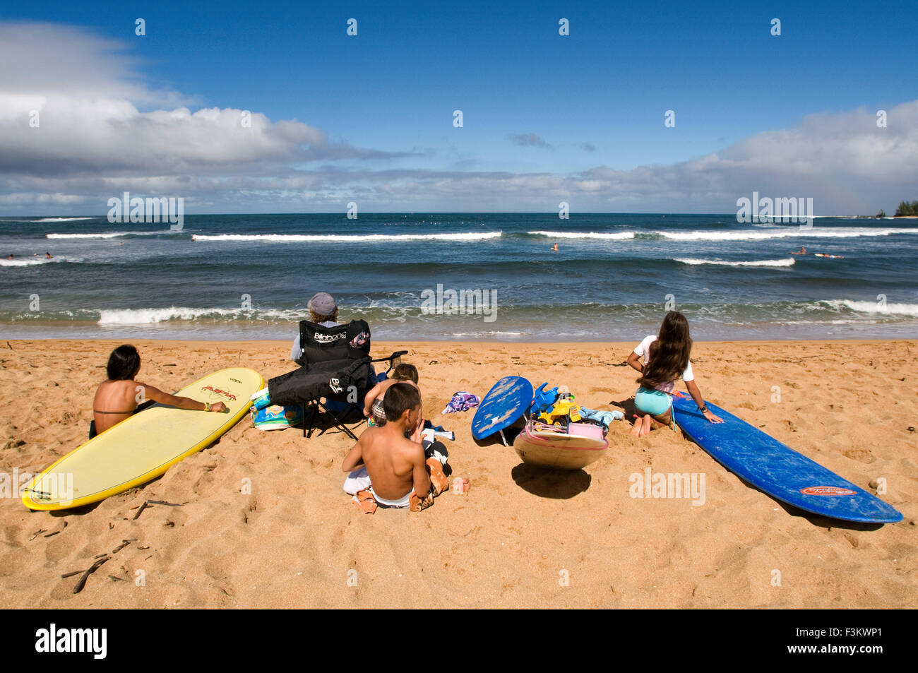 Surfers family on the beach Ali'i Beach Park. Haleiwa. O'ahu. Hawaill ...
