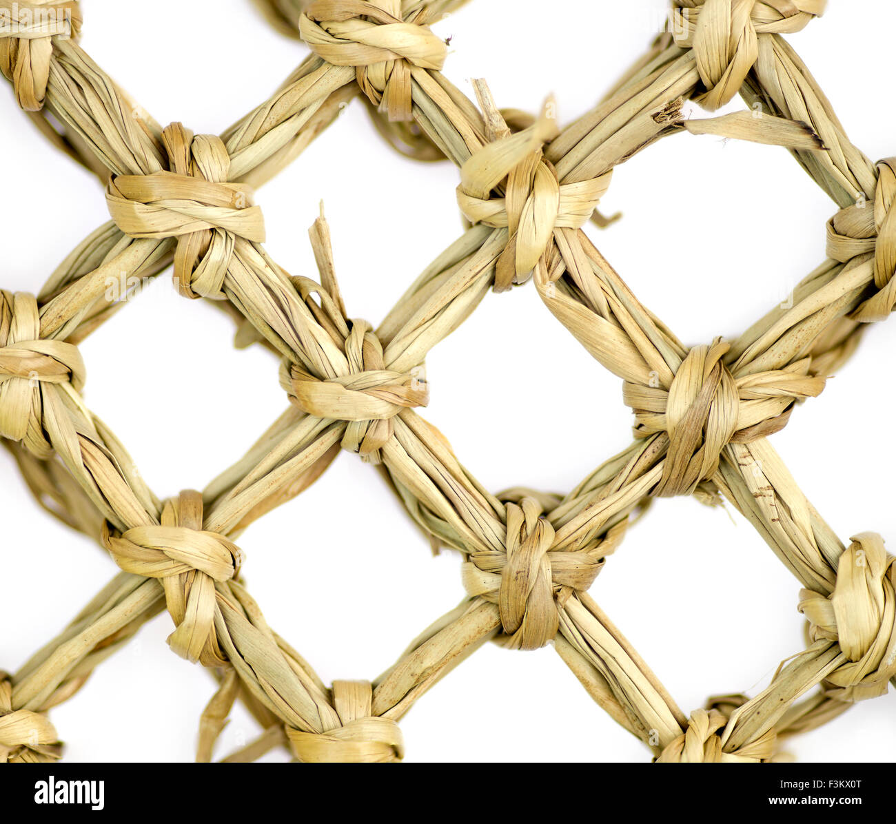 Woven knotted mesh background isolated against white Stock Photo - Alamy