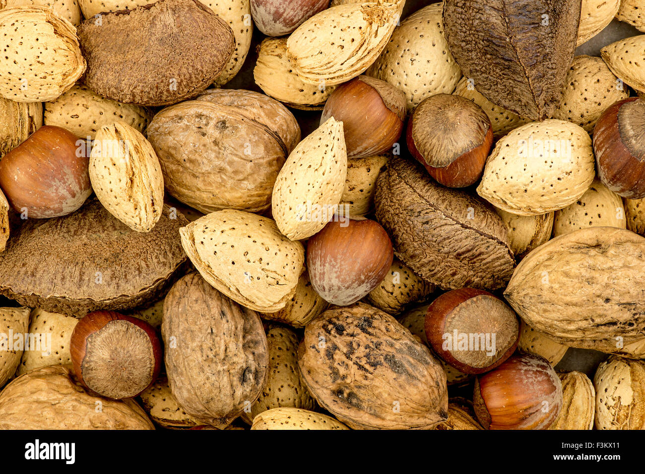 Mixed nuts background texture Stock Photo - Alamy