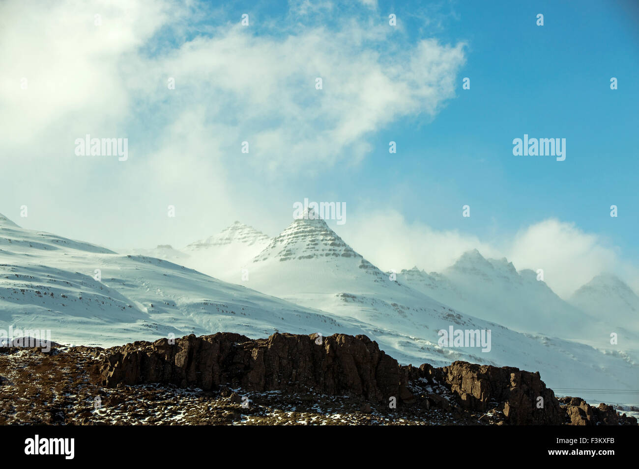 Snow-covered volcanic mountain landscape in Iceland Stock Photo - Alamy