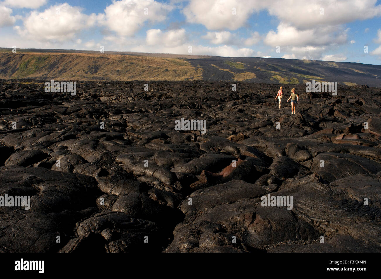 Black lava mountains near the coast and highway Chain of Crater Road ...