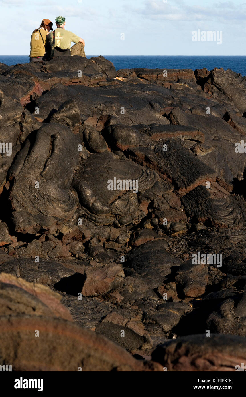 Black lava mountains near the coast and highway Chain of Crater Road ...