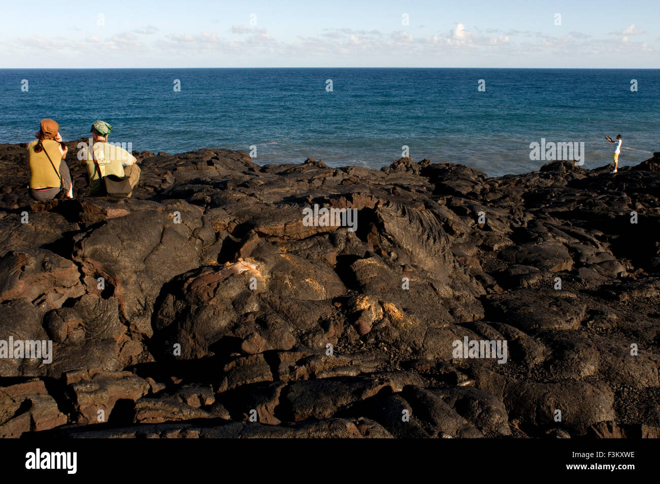 Black lava mountains near the coast and highway Chain of Crater Road ...