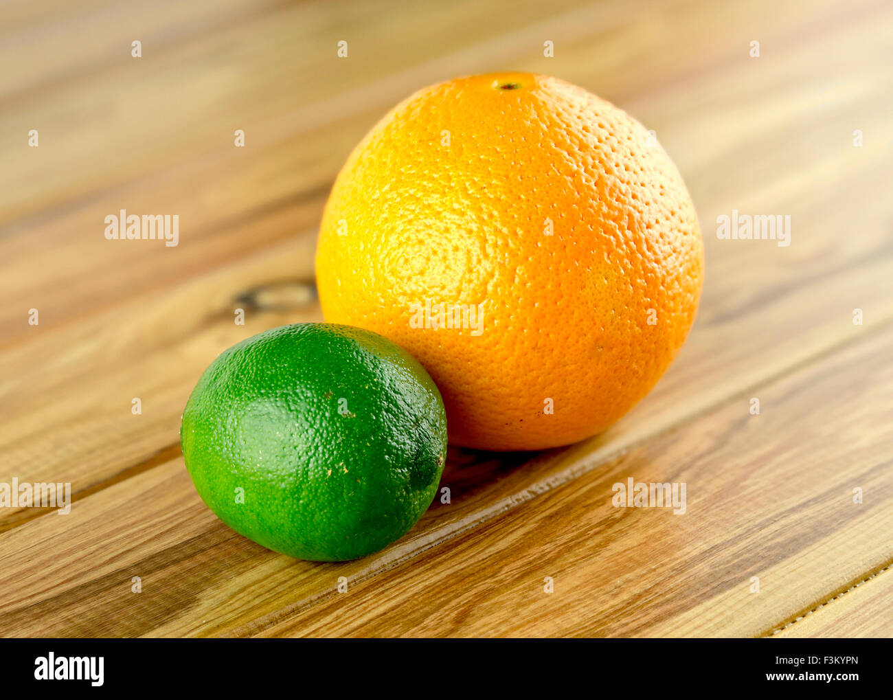Orange and lime, colorful daytime snack Stock Photo - Alamy