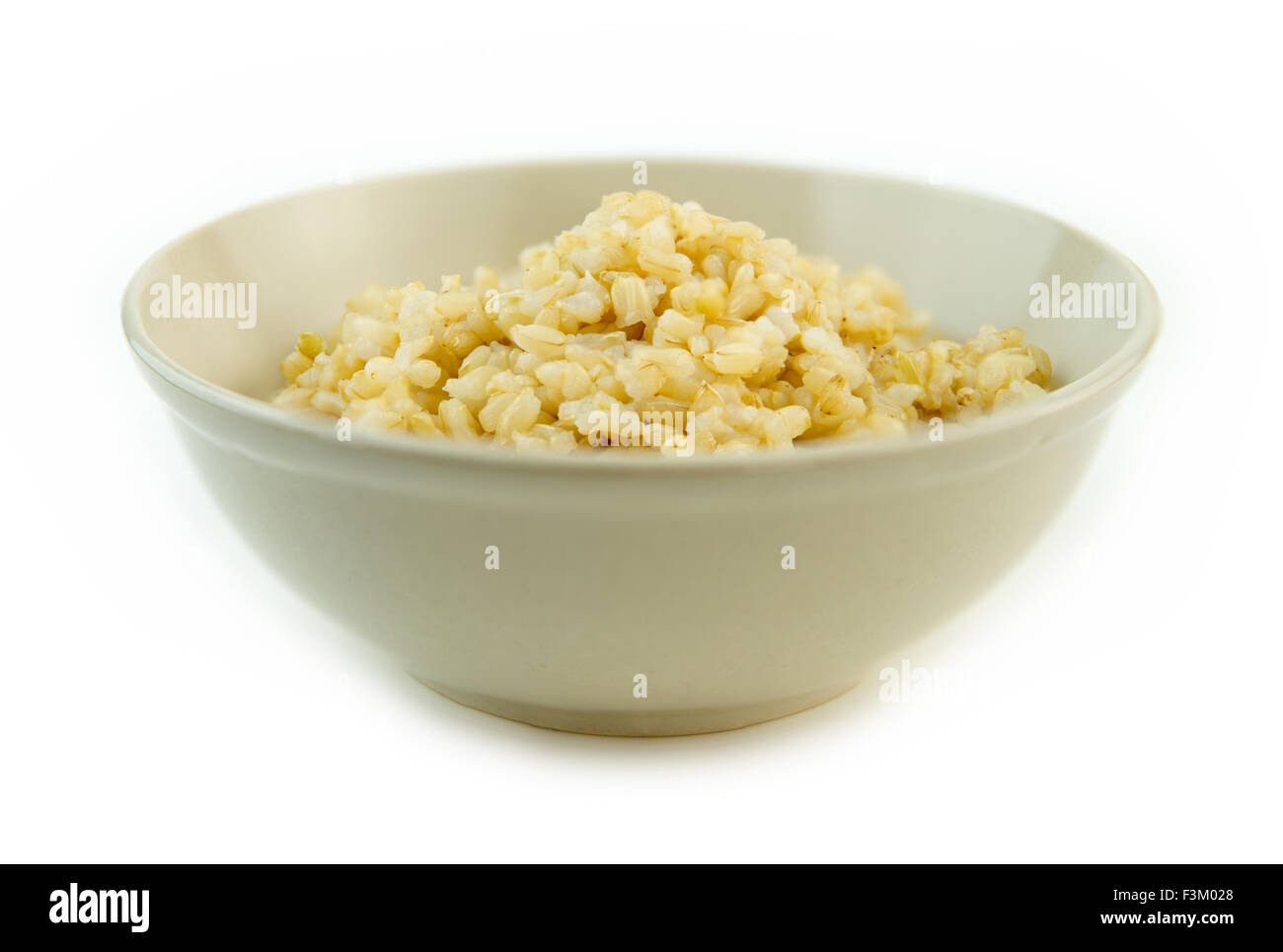 Isolated bowl with brown rice against white Stock Photo - Alamy