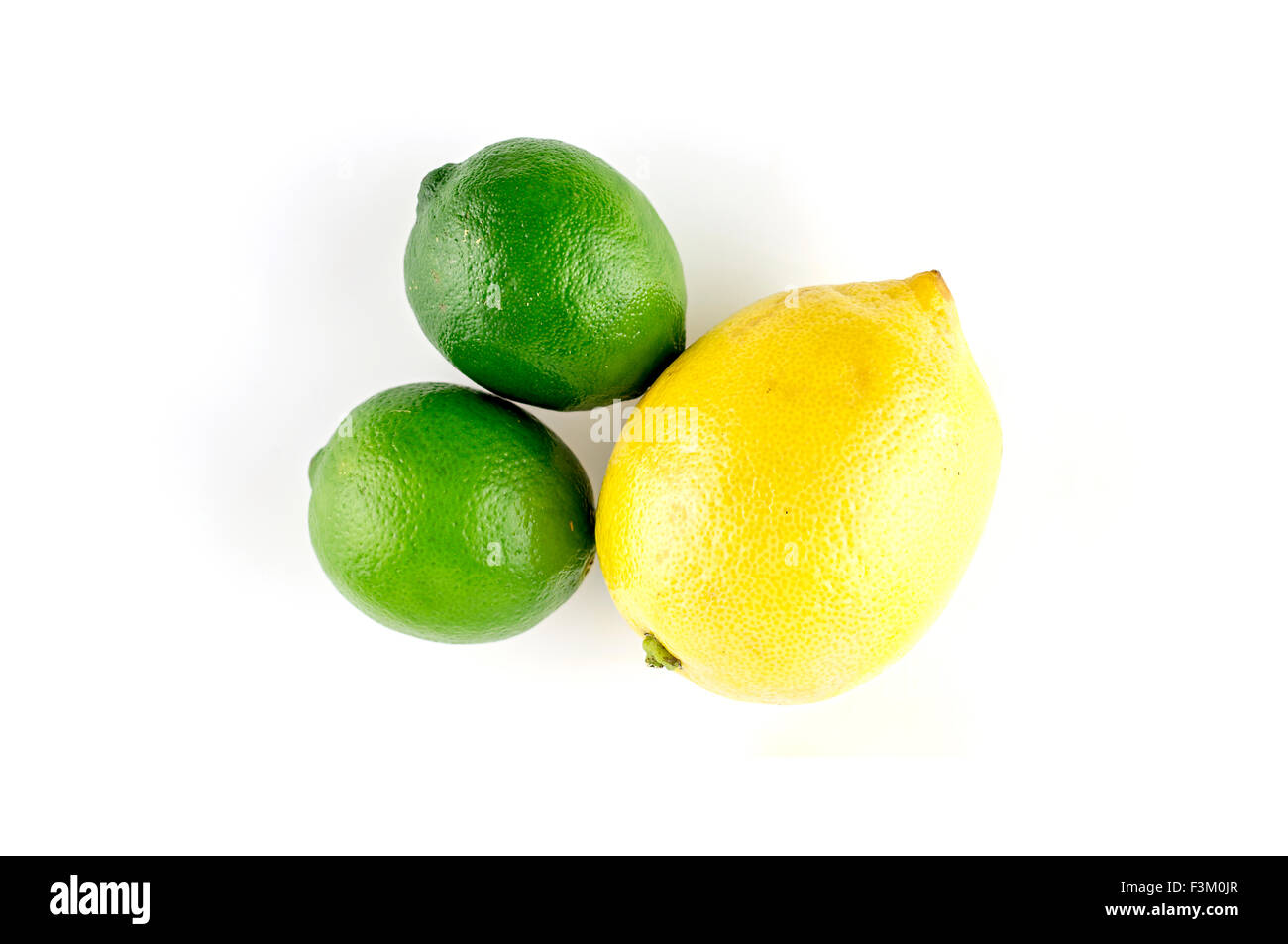 Aerial isolated macro closeup of citrus lemon and limes against white ...