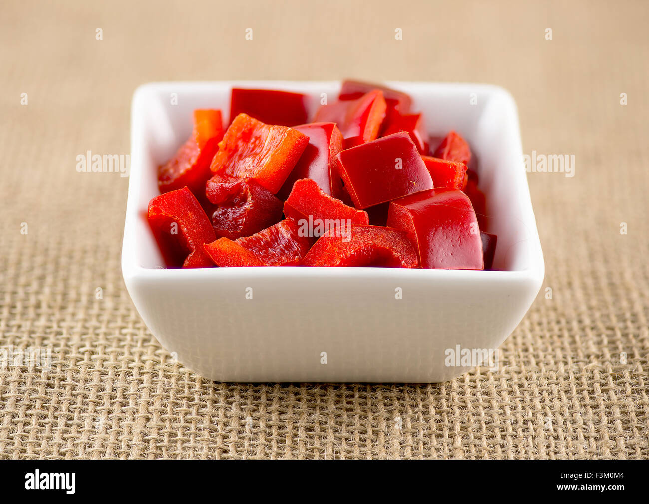 Delicious organic diced capsicum on burlap background Stock Photo - Alamy
