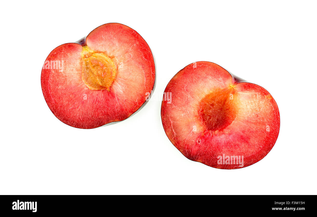 Plum cut in half, vibrant juicy insides Stock Photo - Alamy