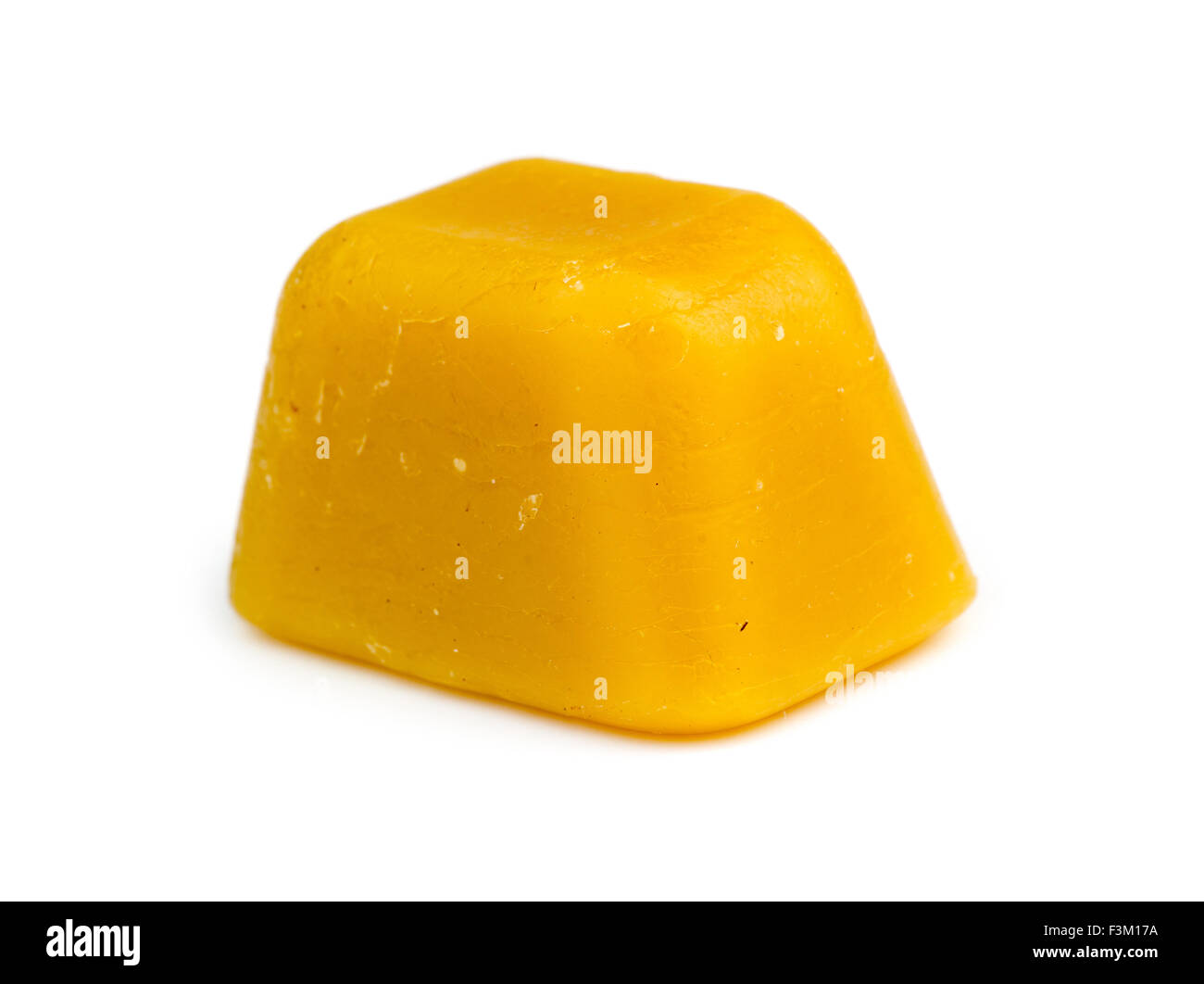 Isolated single cube of beeswax on white background Stock Photo - Alamy
