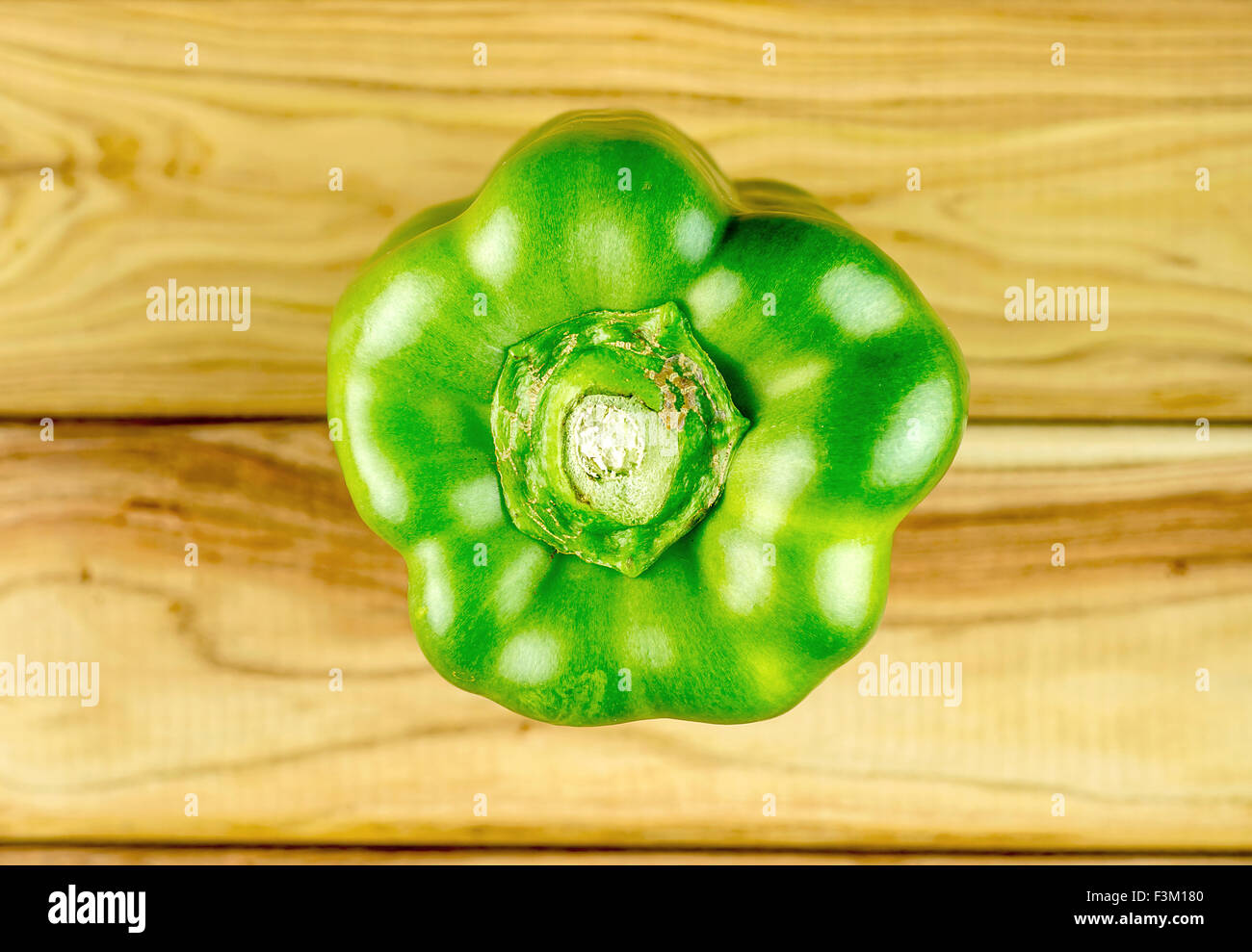 Aerial of green capsicum on cutting board Stock Photo - Alamy