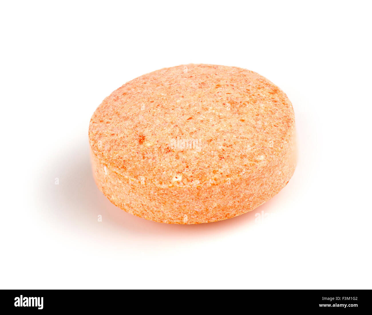 Macro closeup of orange vitamin c chewable tablet isolated on white ...