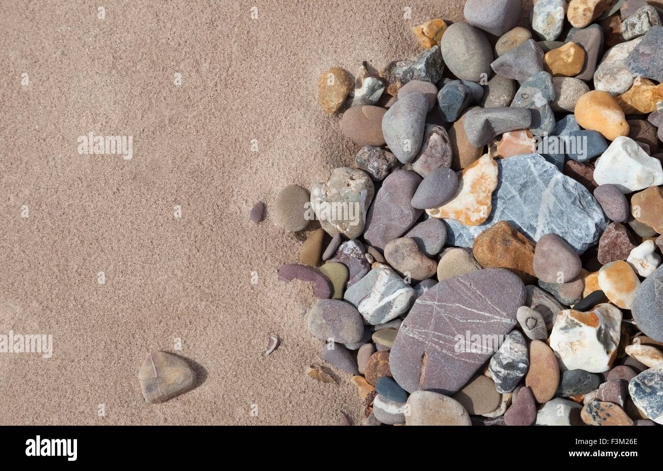 Sand and pebble background with space for copy Stock Photo - Alamy