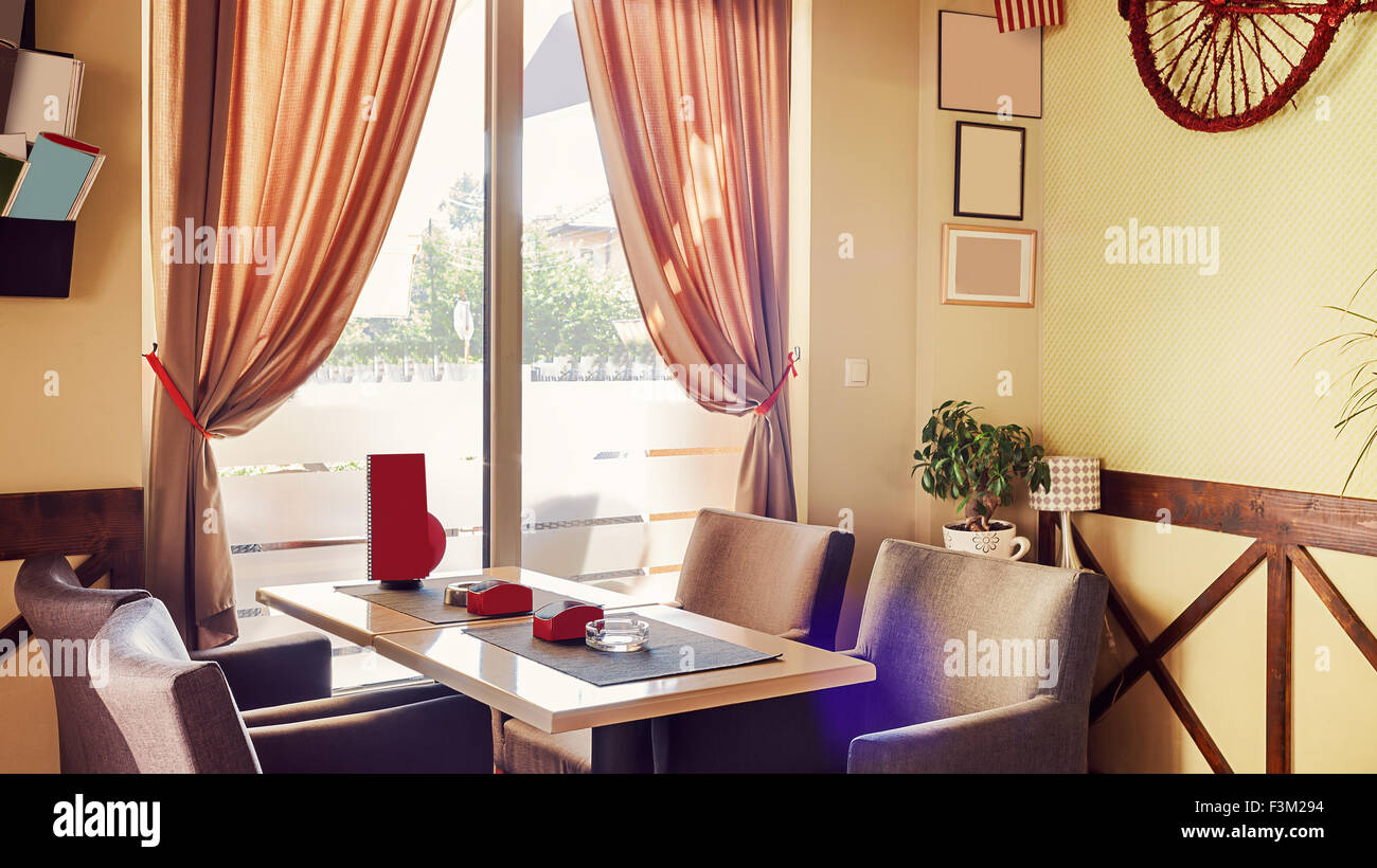 Interior of a modern cafe in retro style, during day. Furniture and ...
