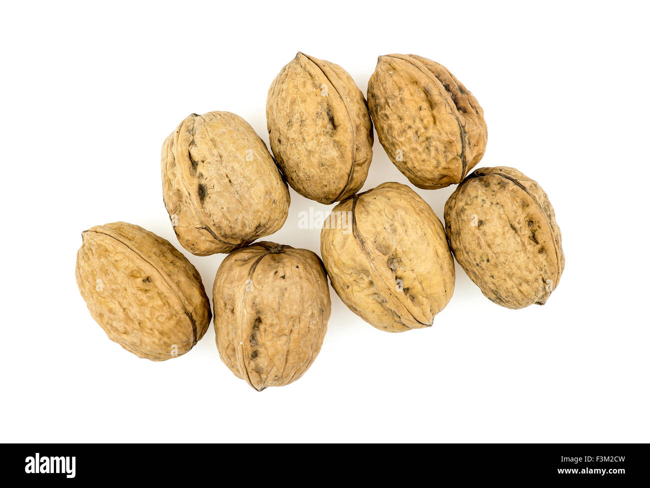 Pile of walnuts in shells isolated on white Stock Photo - Alamy