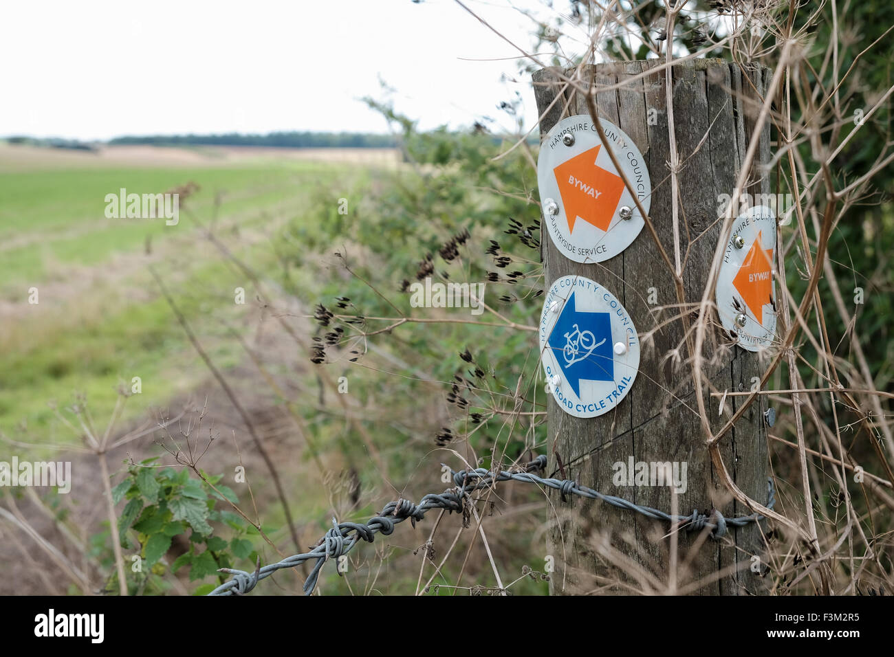 Byway and footpath signs on a post in a field Stock Photo - Alamy