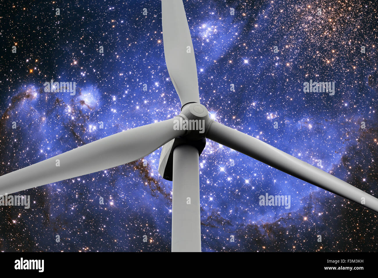 Wind turbine at night against star background Stock Photo - Alamy