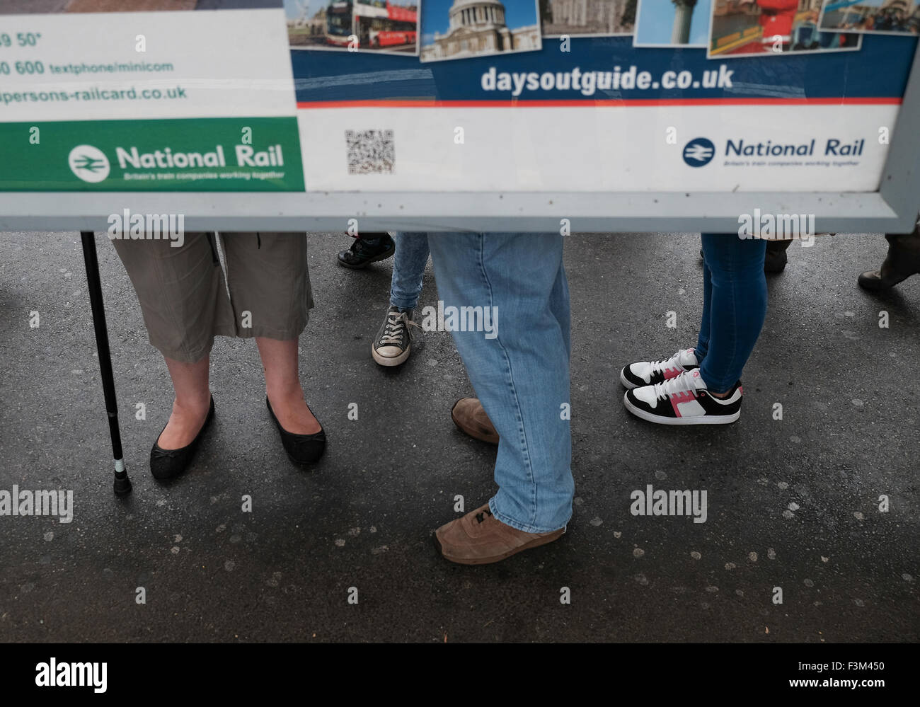 National rail people on train platform waiting Stock Photo - Alamy