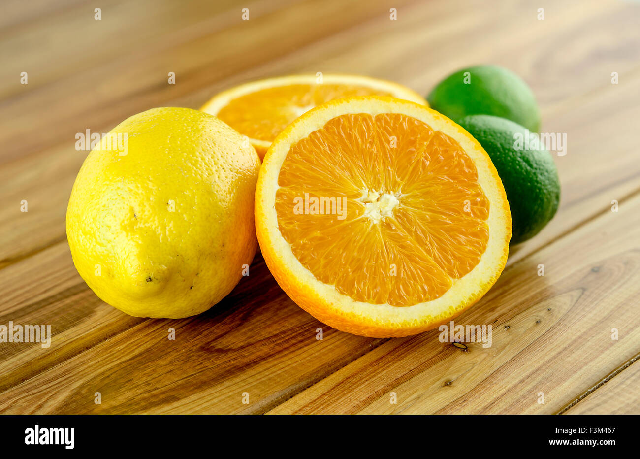 Delicious citrus medley of oranges, lemon and limes against rustic ...