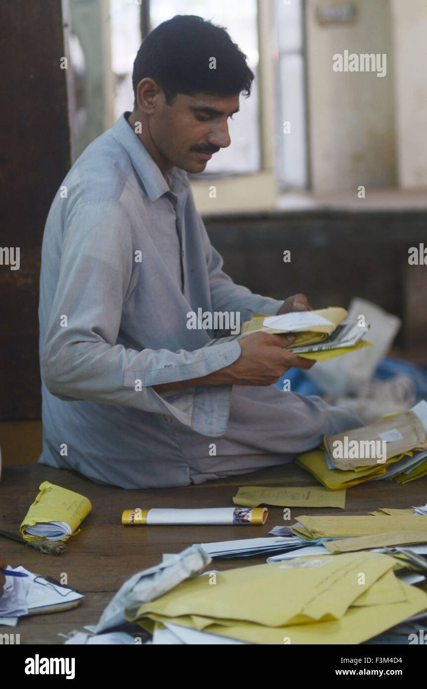 Lahore, Pakistan. 09th Oct, 2015. Pakistani post office worker sorts ...
