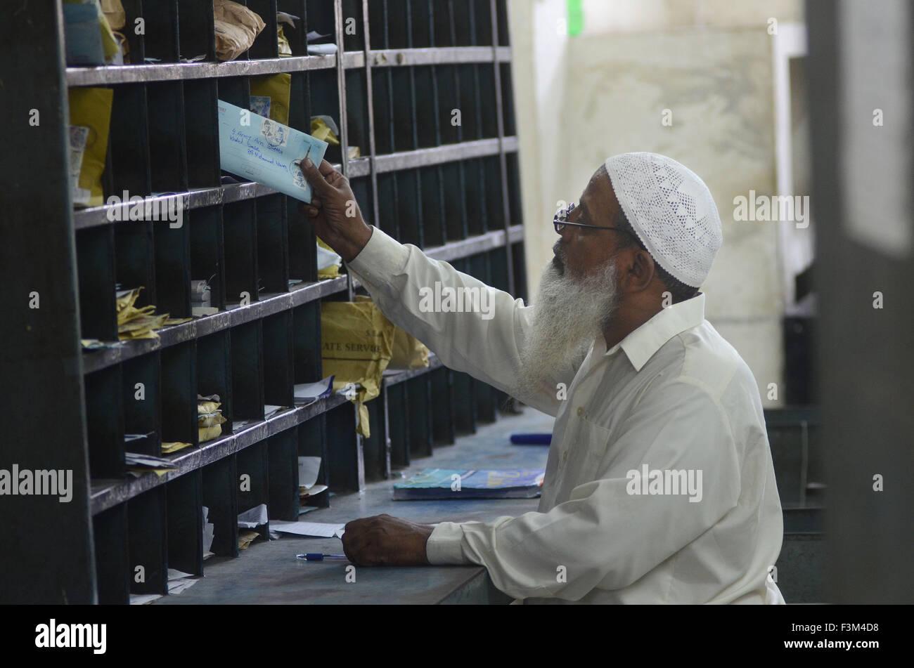 Lahore, Pakistan. 09th Oct, 2015. Pakistani post office worker sorts ...