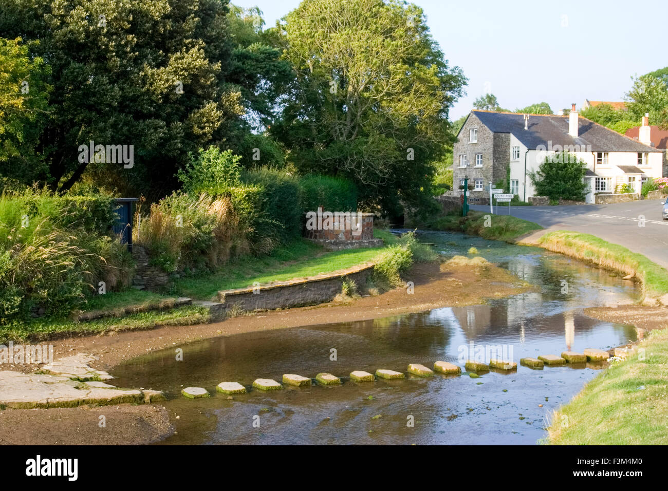 South Pool, Devon, UK. Pedestrian stepping stones across river in ...