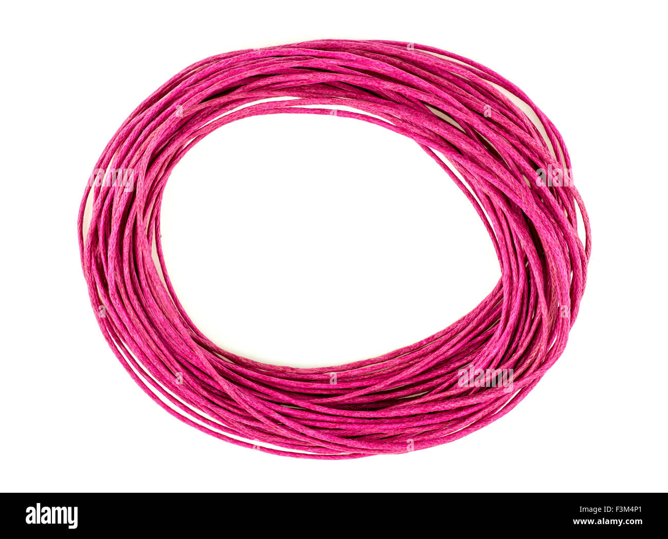 Pink circular loop of bright colorful rope twine isolated against white ...