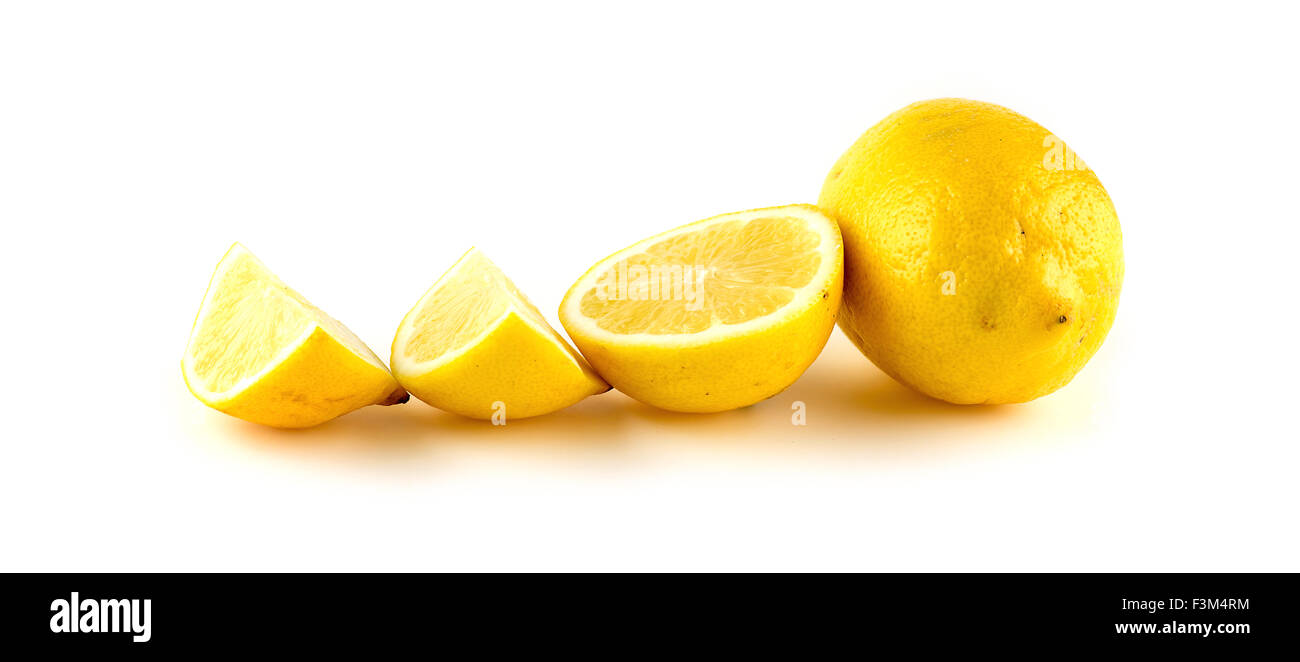 Cut lemons isolated on white Stock Photo - Alamy