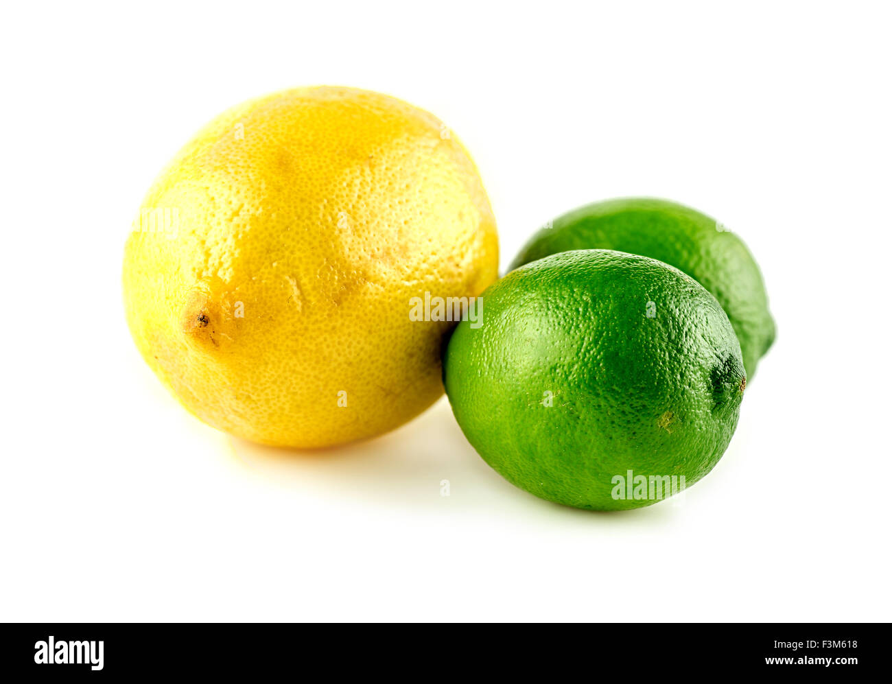 Lemon and two limes isolated in studio against white background Stock ...