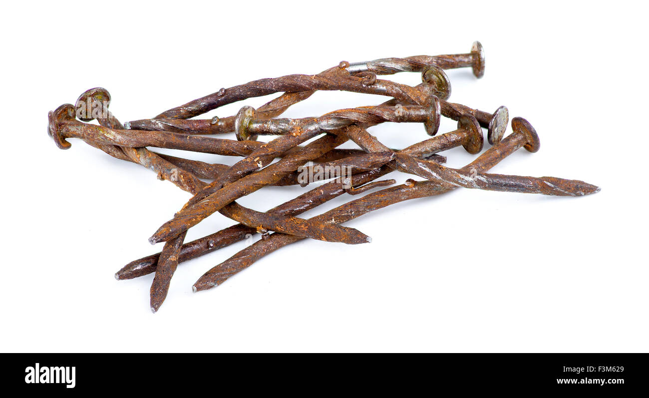 Macro of pile of rusty nails isolated against white Stock Photo - Alamy