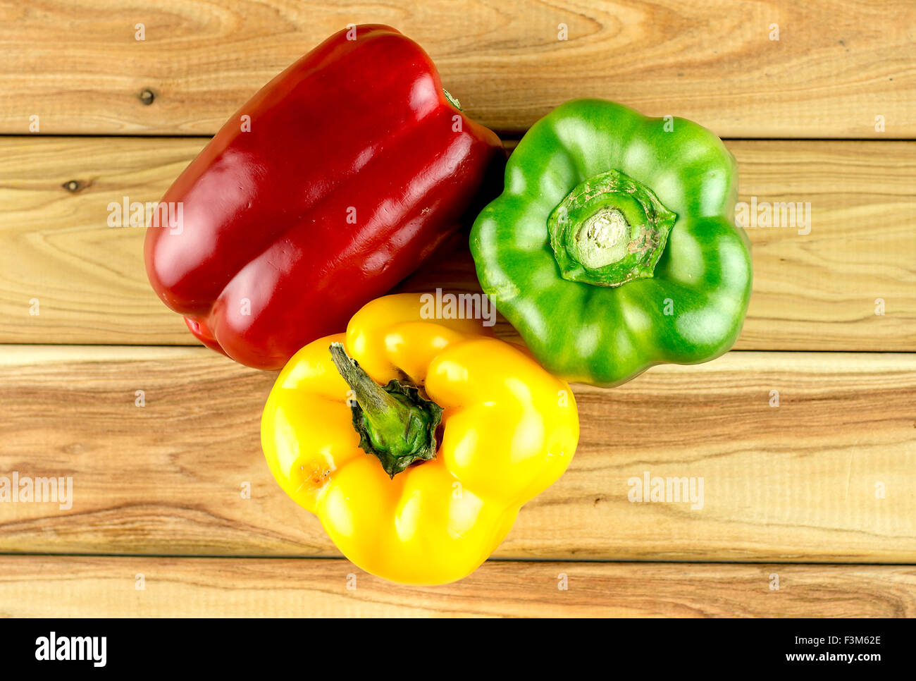 Ripe peppers on chopping board Stock Photo - Alamy