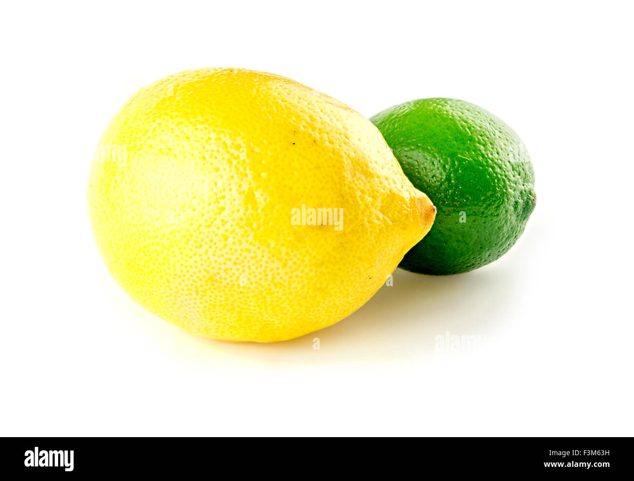 Macro closeup of a bright organic lemon and green baby lime Stock Photo ...