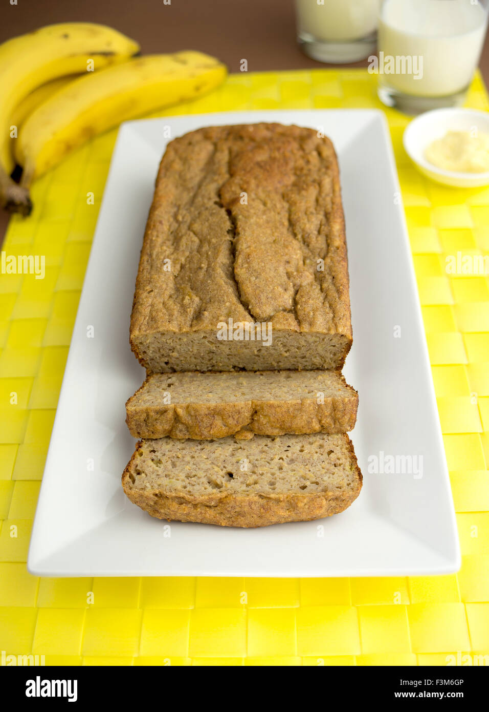 Banana bread cake with slices presented on a rectangle plate. Served ...