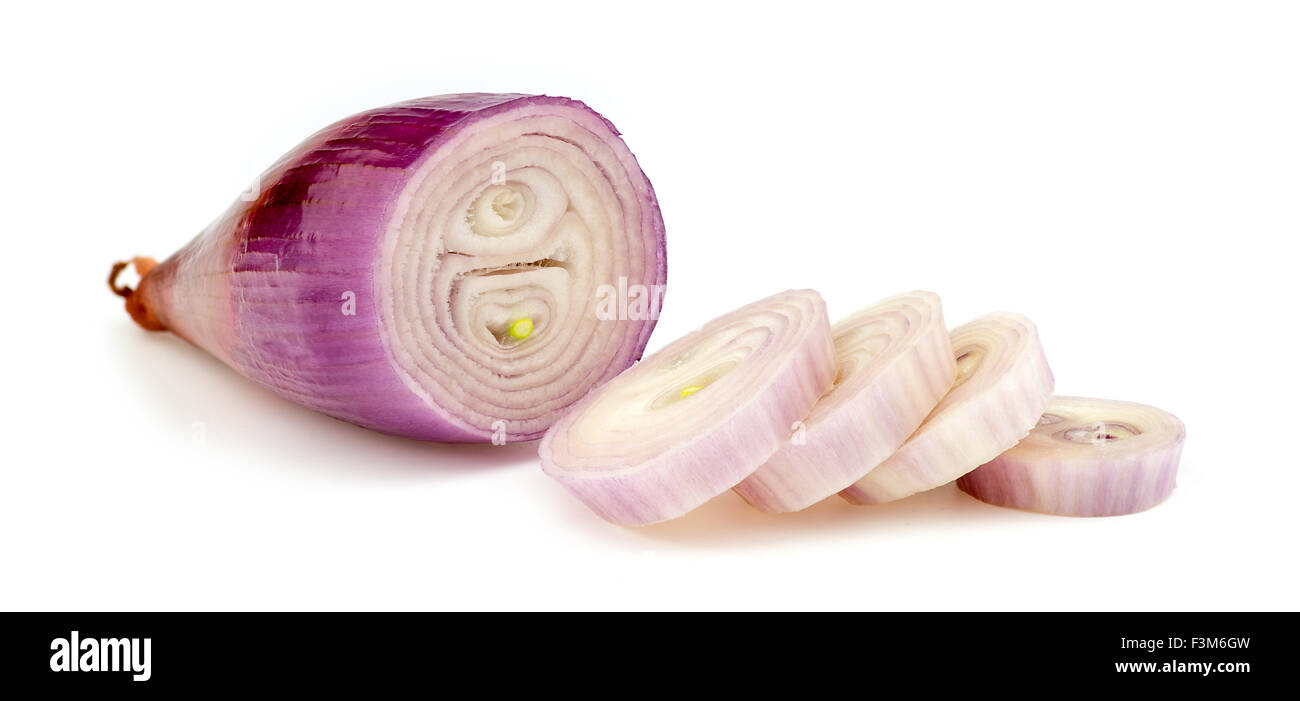 Pieces of echalion onion isolated on white Stock Photo - Alamy