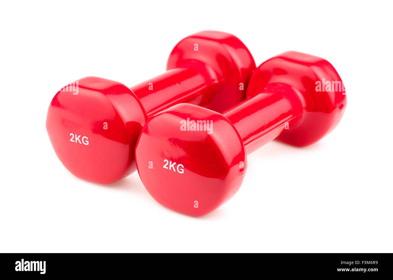 Pair of red dumbbells isolated on white Stock Photo - Alamy