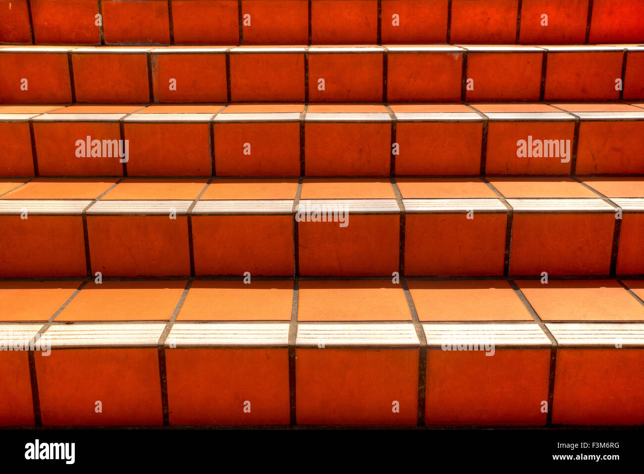 Orange tiled stairs texture going upwards Stock Photo - Alamy