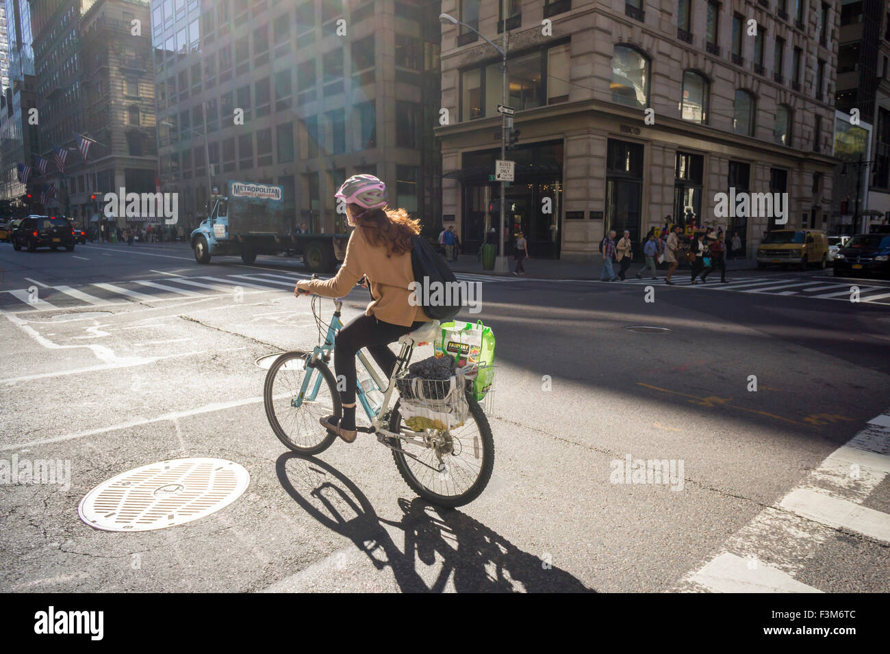 A bicyclist travels down Fifth Avenue in New York on Tuesday, October 6 ...