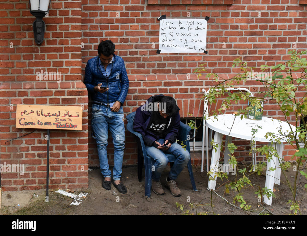 Two refugees the grounds of a refugee processing centre in the public ...