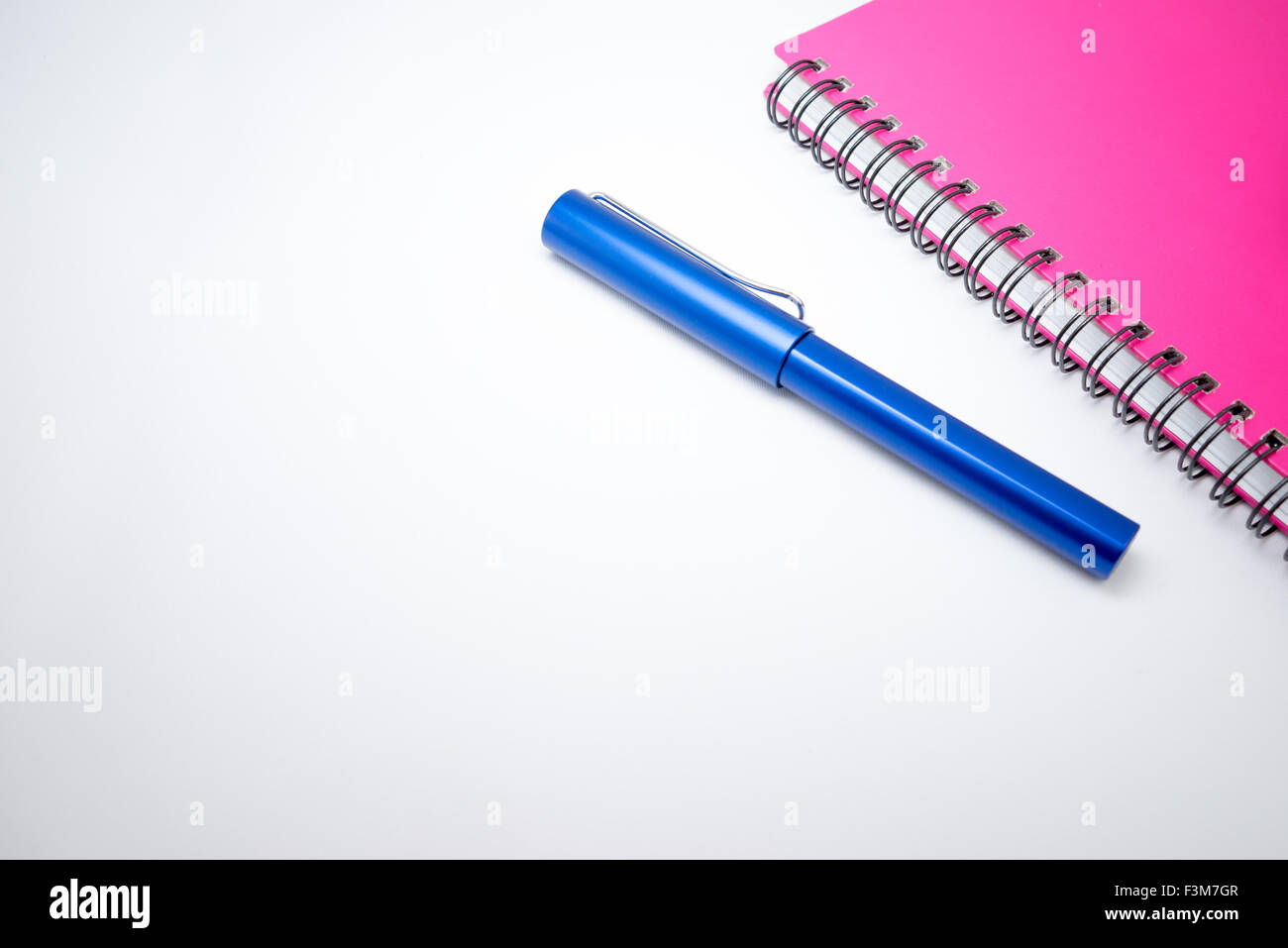 Notebook and pen isolated on white background Stock Photo - Alamy