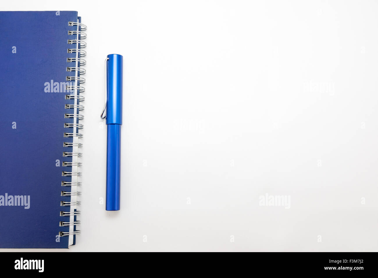 Notebook and pen isolated on white background Stock Photo - Alamy