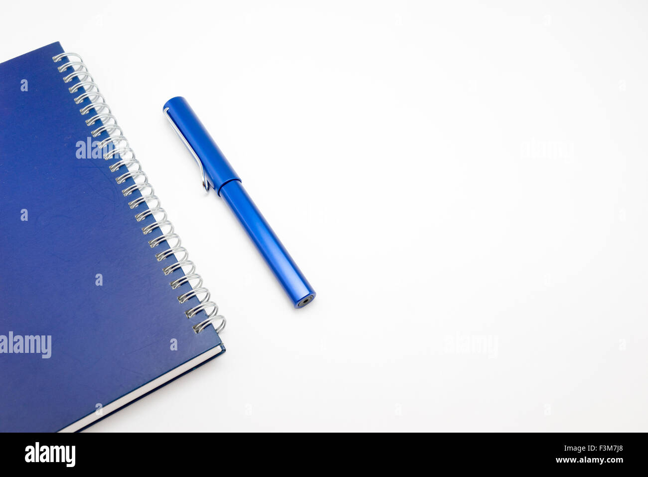 Notebook and pen isolated on white background Stock Photo - Alamy