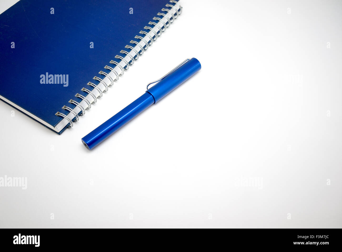 Notebook and pen isolated on white background Stock Photo - Alamy