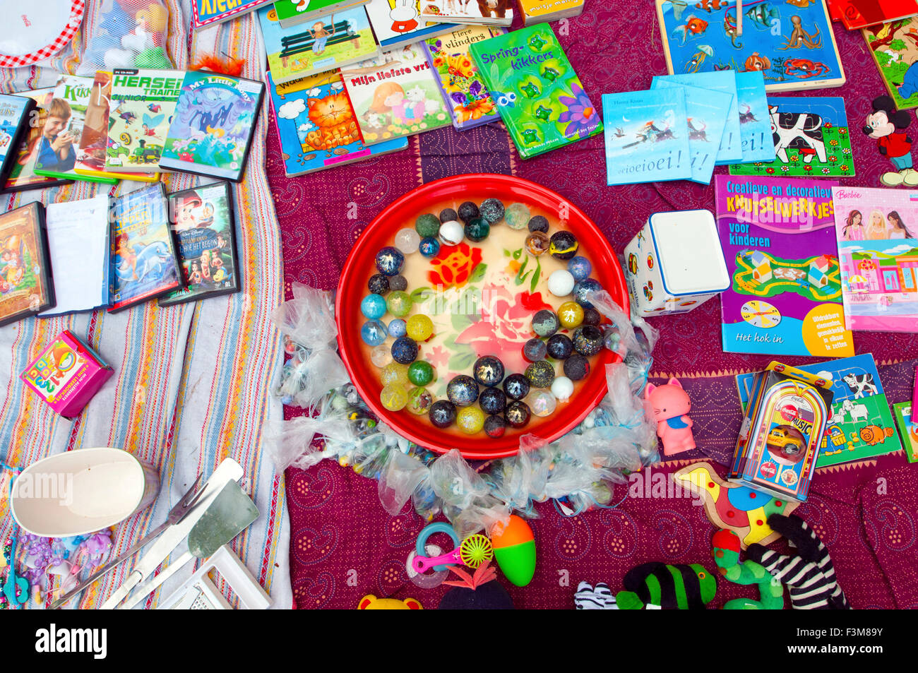 Assorted items in close up at flea market Kings Day The Netherlands ...