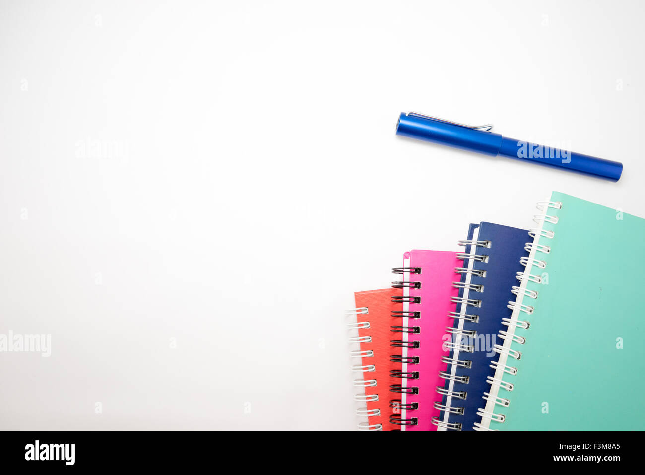 Notebook and pen isolated on white background Stock Photo - Alamy