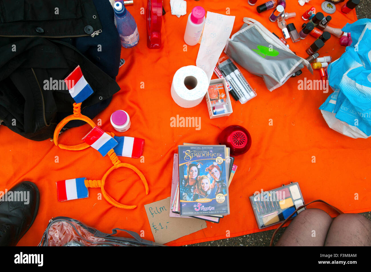Assorted items in close up at flea market Kings Day The Netherlands ...