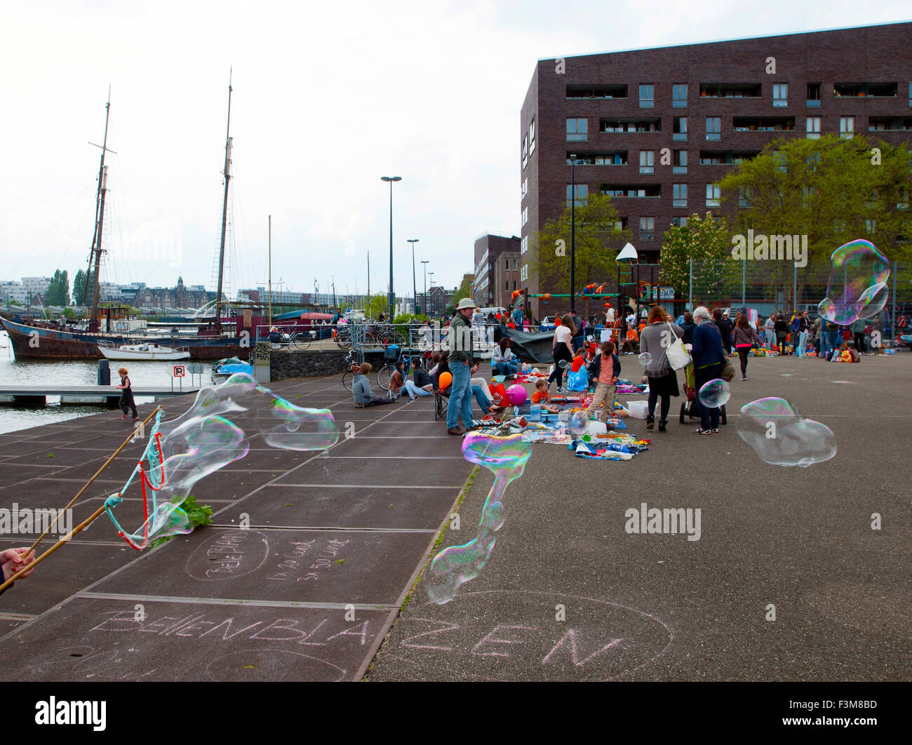 Large Soap bubbles and flea market at Kings Day, Amsterdam, The ...